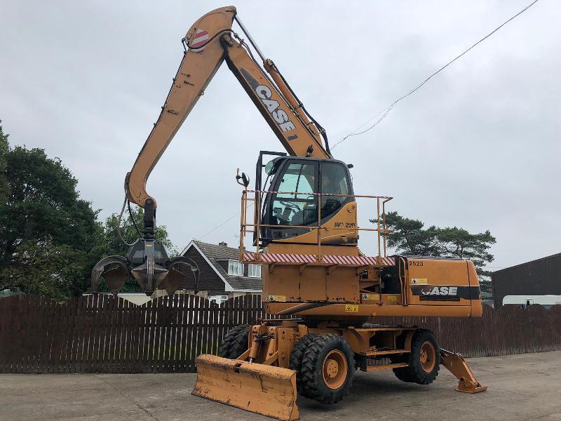 CASE WX210 WHEELED SCRAP HANDLER C/W SELF ROTATING 5 TINE GRAB ( PLEASE ...