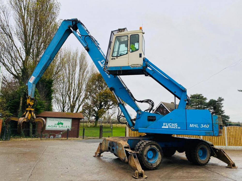 FUCHS MHL340 HIGH RISE CABIN SCRAP HANDLER C/W 5 TINE SCRAP GRAB
