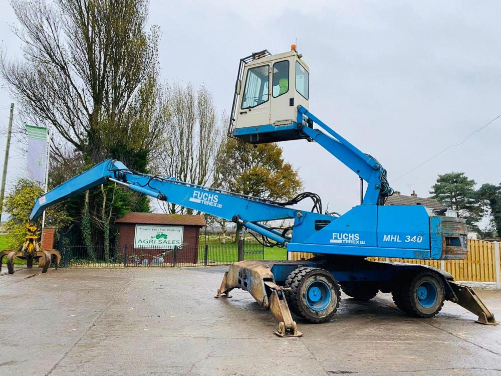 FUCHS MHL340 HIGH RISE CABIN SCRAP HANDLER C/W 5 TINE SCRAP GRAB