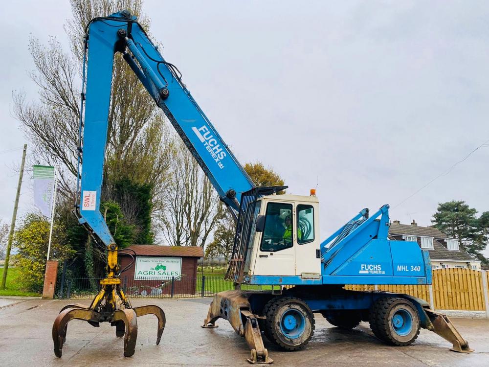 FUCHS MHL340 HIGH RISE CABIN SCRAP HANDLER C/W 5 TINE SCRAP GRAB