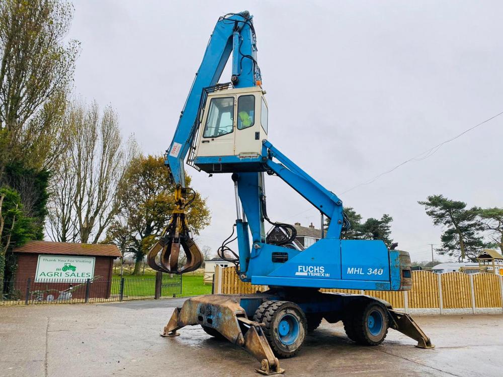 FUCHS MHL340 HIGH RISE CABIN SCRAP HANDLER C/W 5 TINE SCRAP GRAB