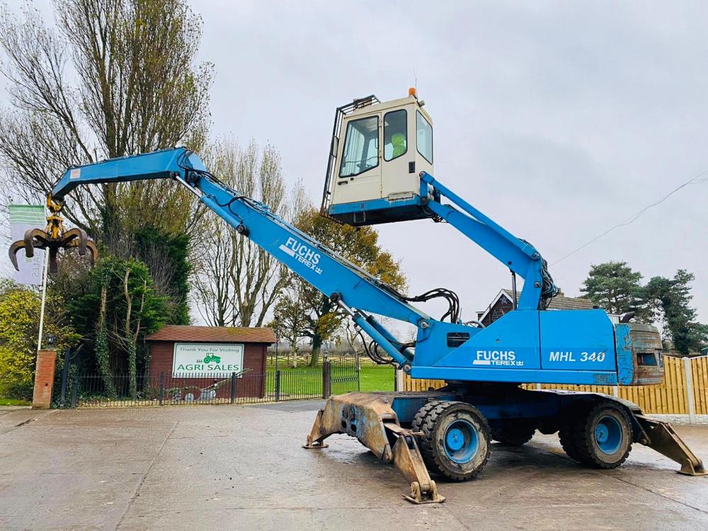 FUCHS MHL340 HIGH RISE CABIN SCRAP HANDLER C/W 5 TINE SCRAP GRAB