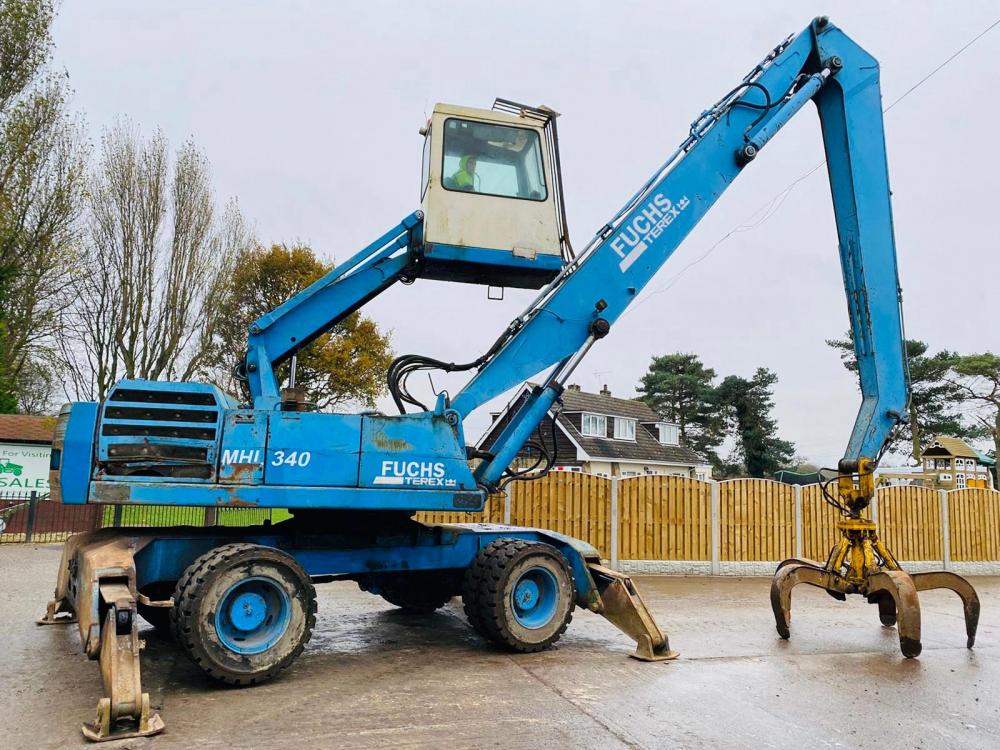 FUCHS MHL340 HIGH RISE CABIN SCRAP HANDLER C/W 5 TINE SCRAP GRAB